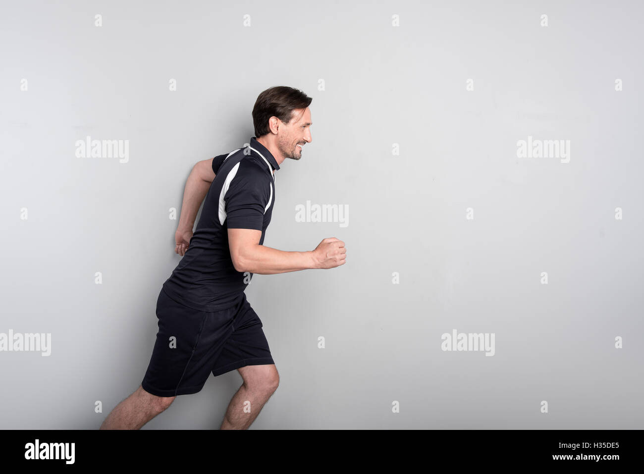 Positive senior man running Stock Photo - Alamy