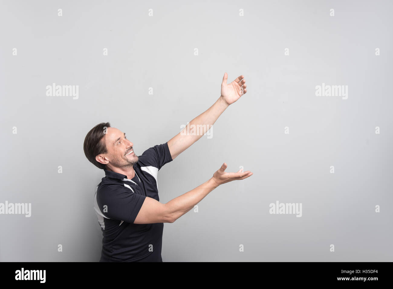 Positive fitness man holding hi-res stock photography and images - Alamy