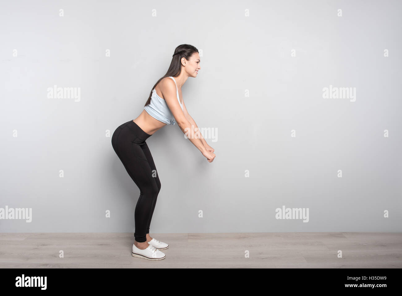 Positive slim woman doing sport exercises Stock Photo - Alamy