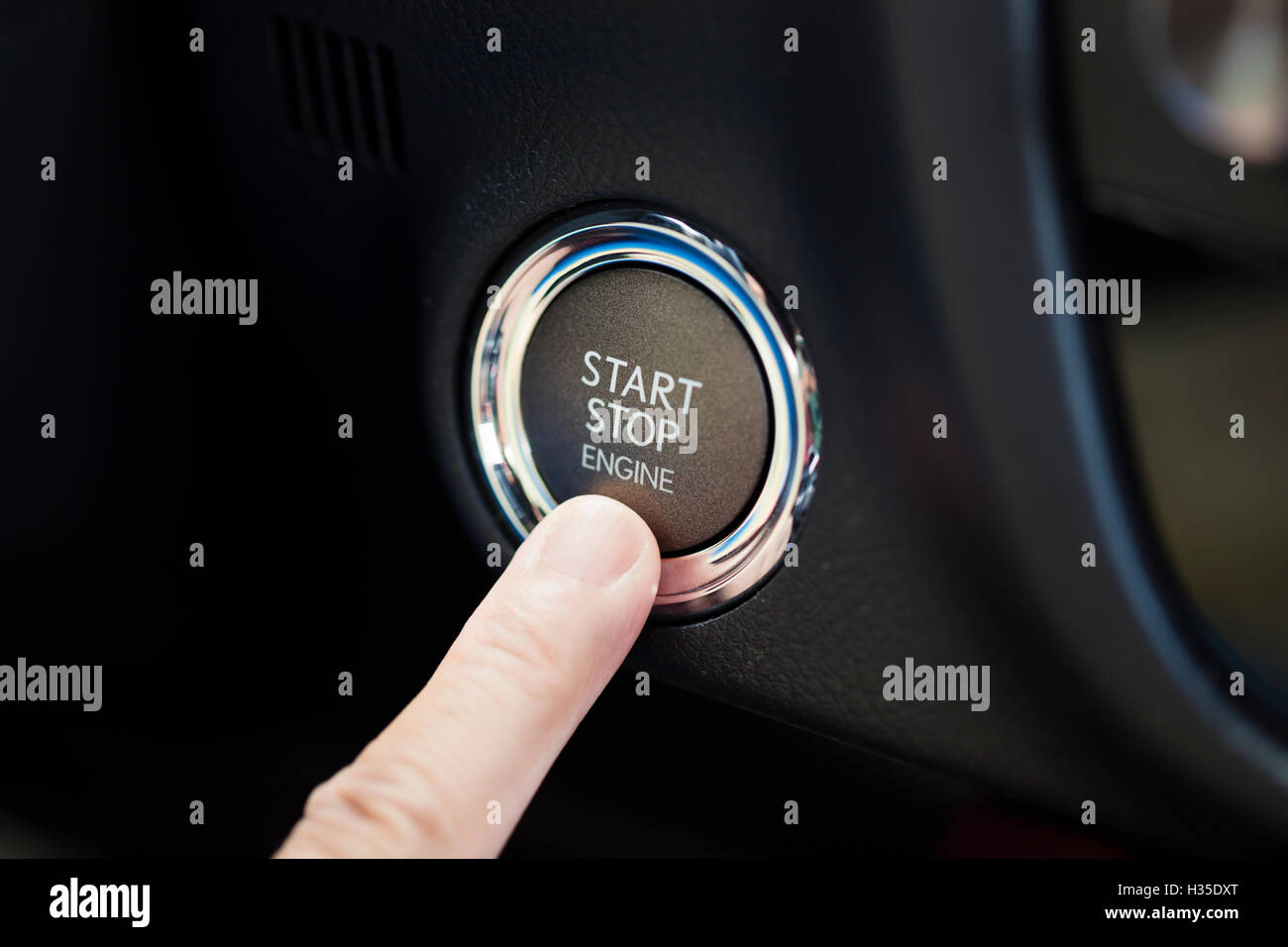 finger pressing the Engine start stop button Stock Photo - Alamy
