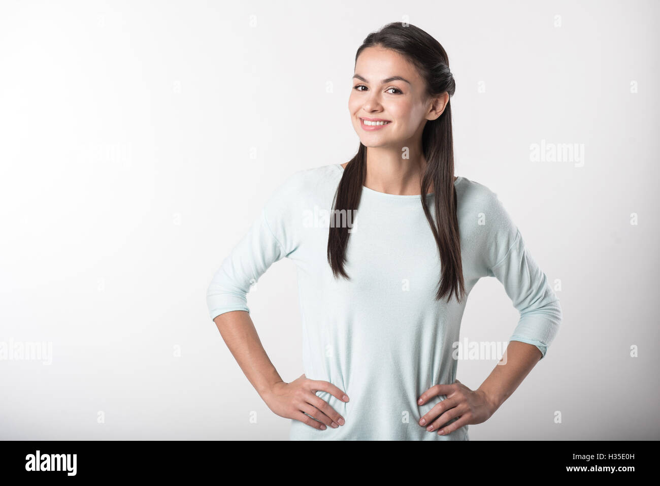 Joyful woman standing isolated on white background Stock Photo - Alamy