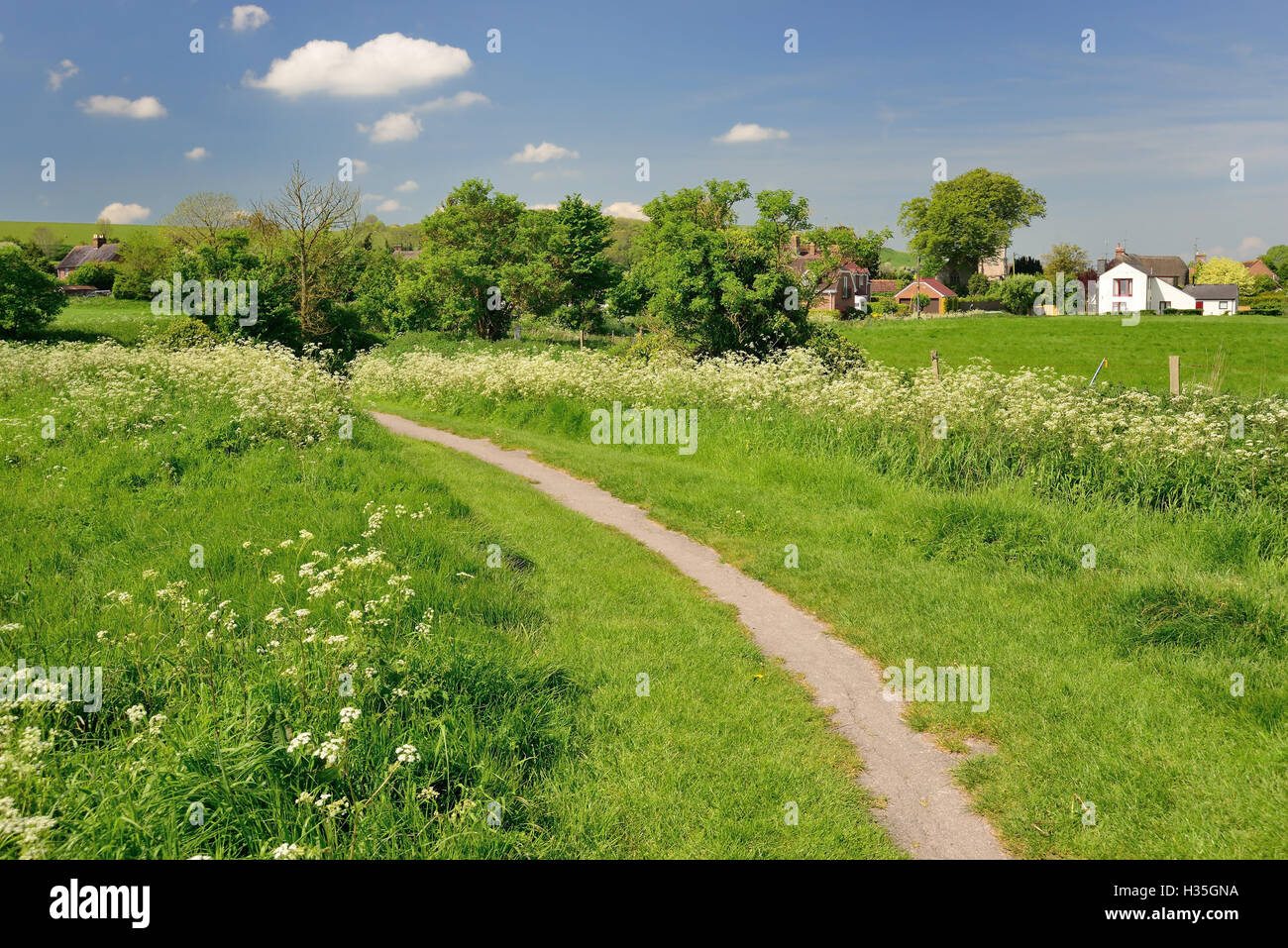 A public footpath to the village Stock Photo - Alamy