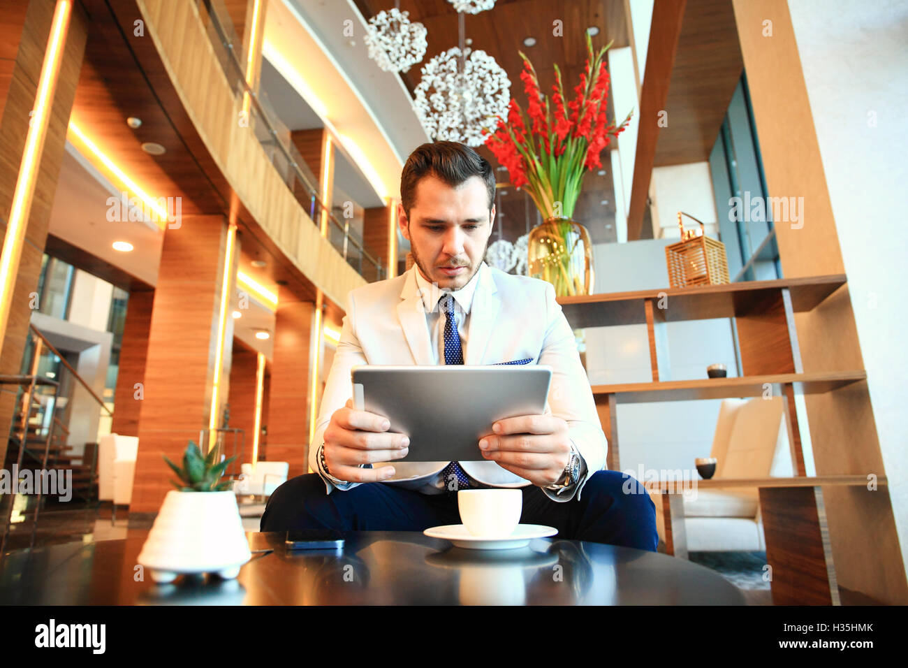 Portrait of handsome successful man drink coffee and look to the ...
