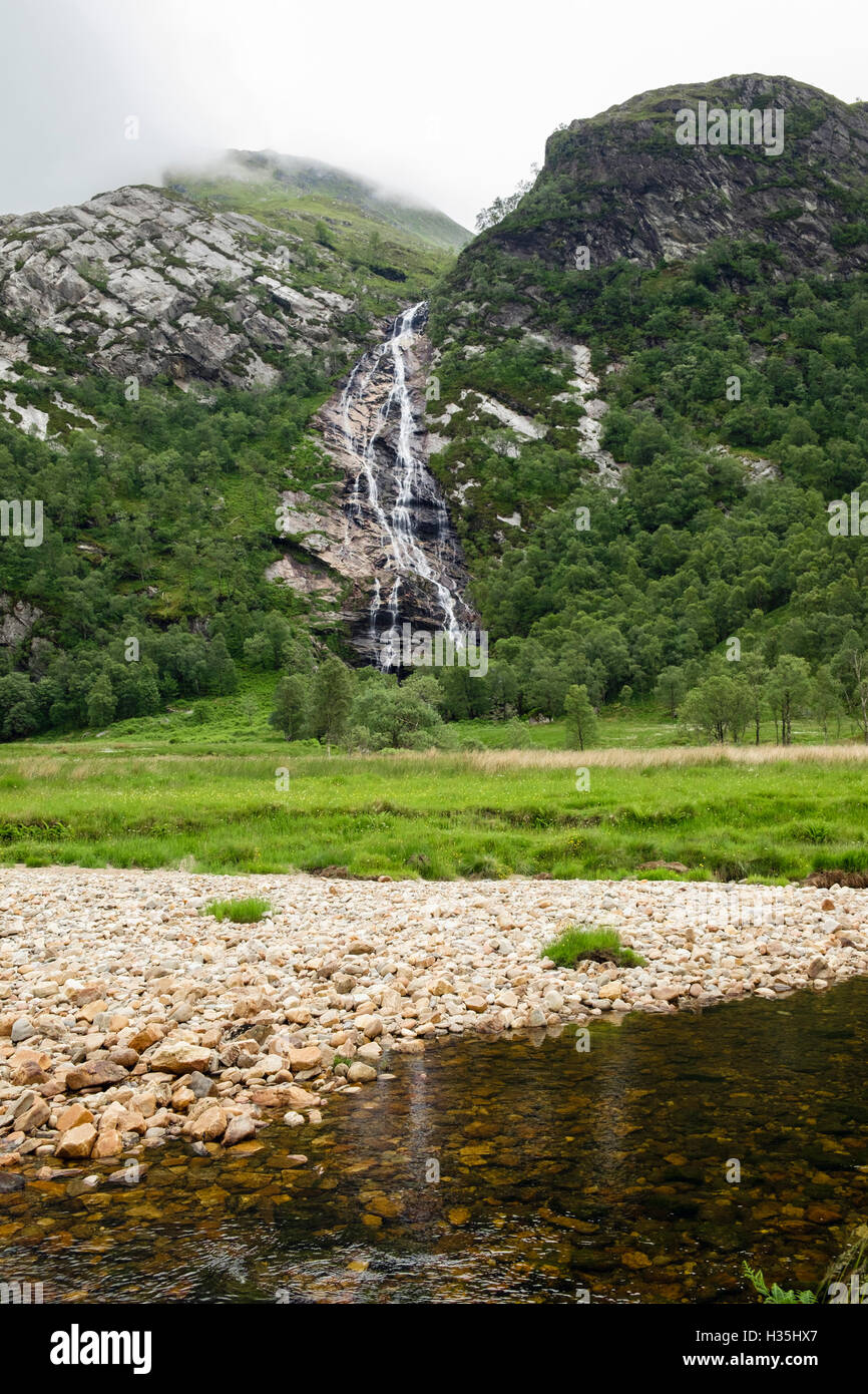 Steall waterfall down mountainside in The Mamores mountains from across ...