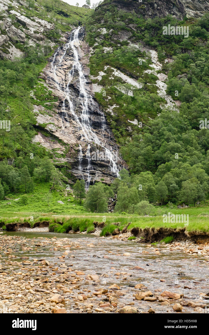 Steall waterfall down mountainside in The Mamores mountains from across ...