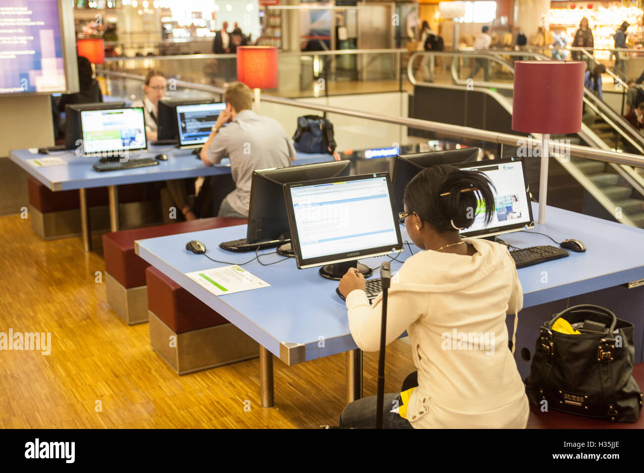 At computer terminals at terminal at Schipol Airport,Amsterdam,Holland ...