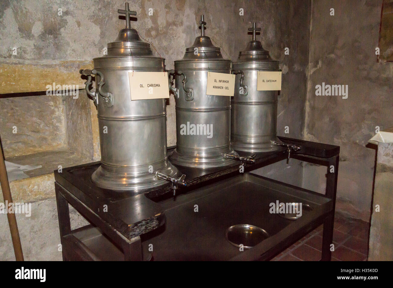 Consecrated sacramental holy oils in chrismatory dispensers in the ...