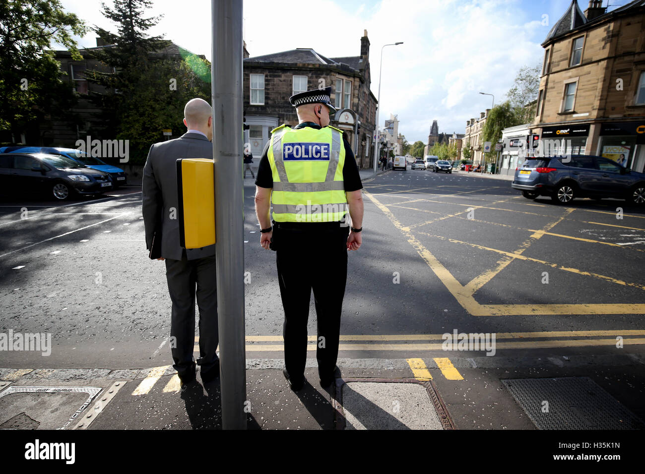 A policeman patrols the area near Salisbury Place, Edinburgh, following ...