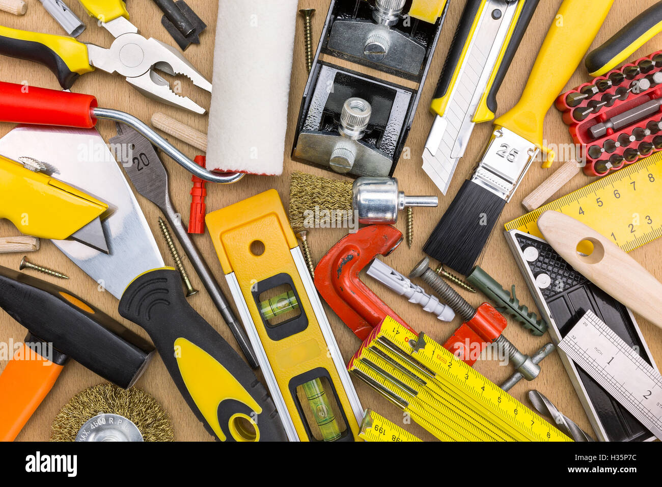 Set of assorted working tools on wooden background Stock Photo - Alamy