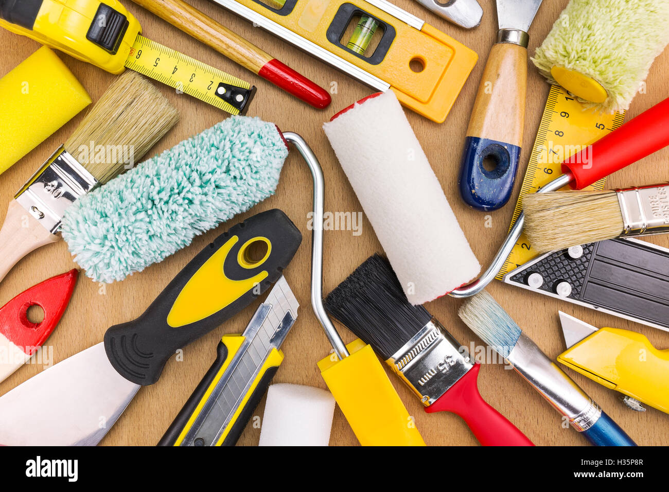 Set of working tools and accessories for home renovation on wooden ...