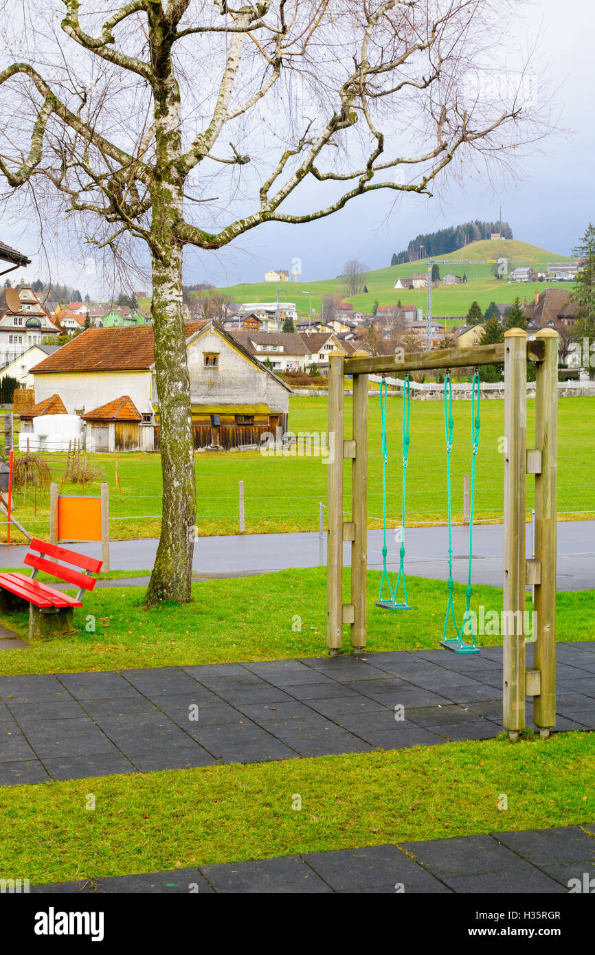 Typical houses, a playground and countryside, in Appenzell, Switzerland ...