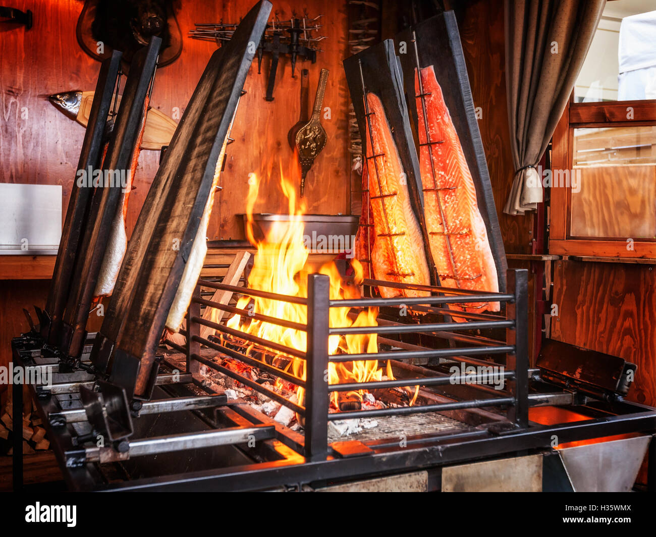 Grilled salmon fish on open fire. Rustic food. Selective focus. Shallow ...