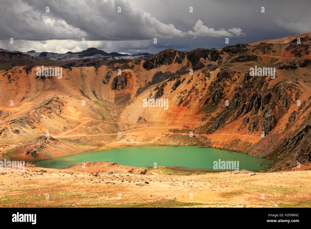 The colorful mountains and a green lake in the peruvian andes n the way ...