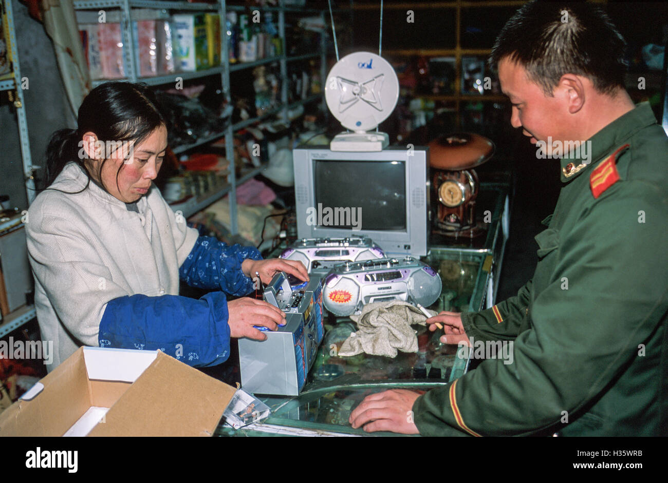 A smoking Chinese army officer checking out and eventually buying this ...