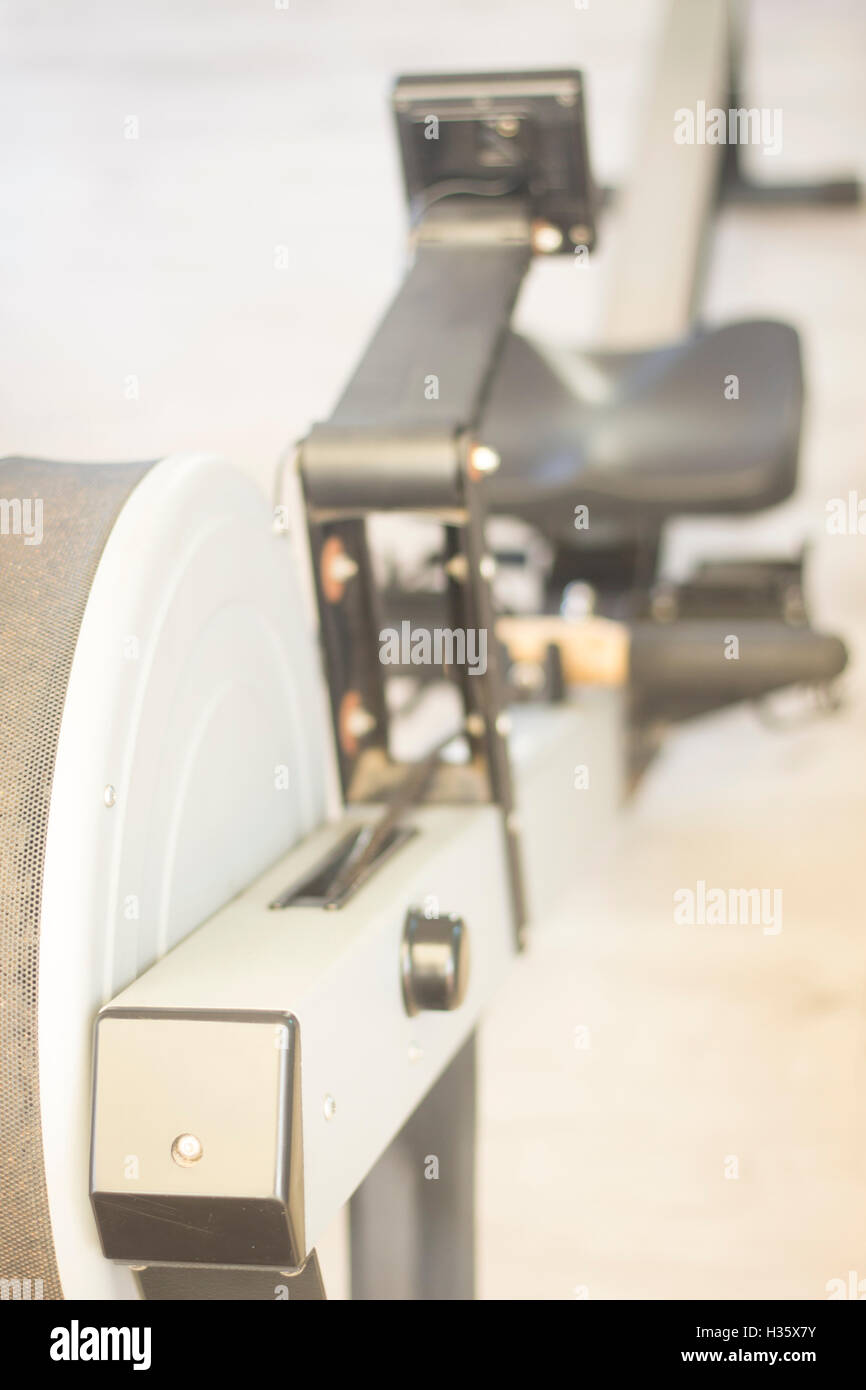 Gym exercise rowing machine static rower in gymnasium fitness studio ...