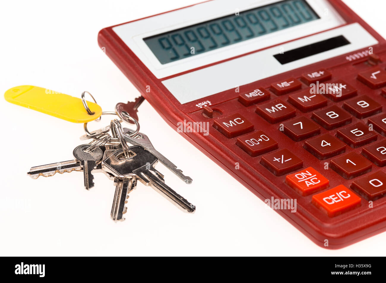 The red calculator with a keys on a white background Stock Photo - Alamy