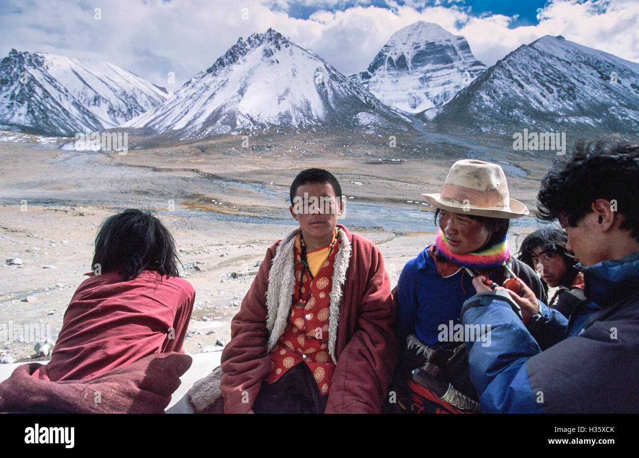Young monk in the centre of this group of Tibetans on the rooftop of ...