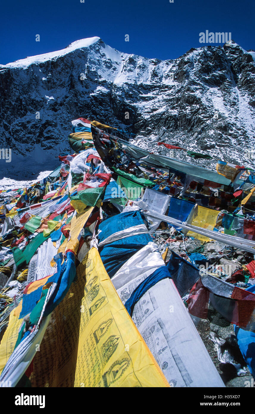 Prayer flags on Dolma Stone at Dolma La pass, at 5,636 metres (18,600 ...