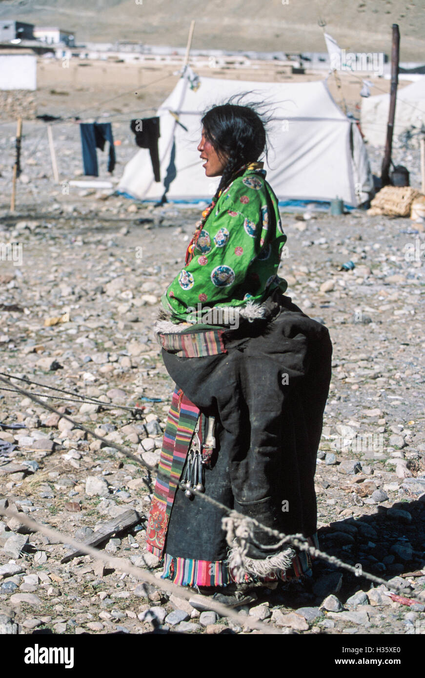 Tibetan woman at her tent encampment at town of Darchen. Darchen is not ...
