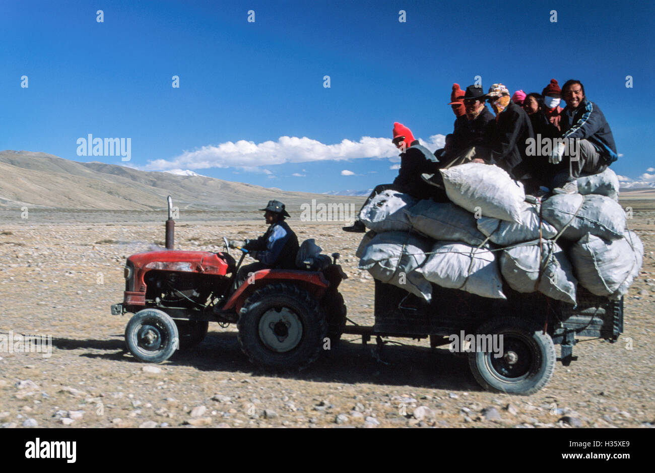 Fully laden tractor struggling,with,heavy,load,loaded with pilgrims ...