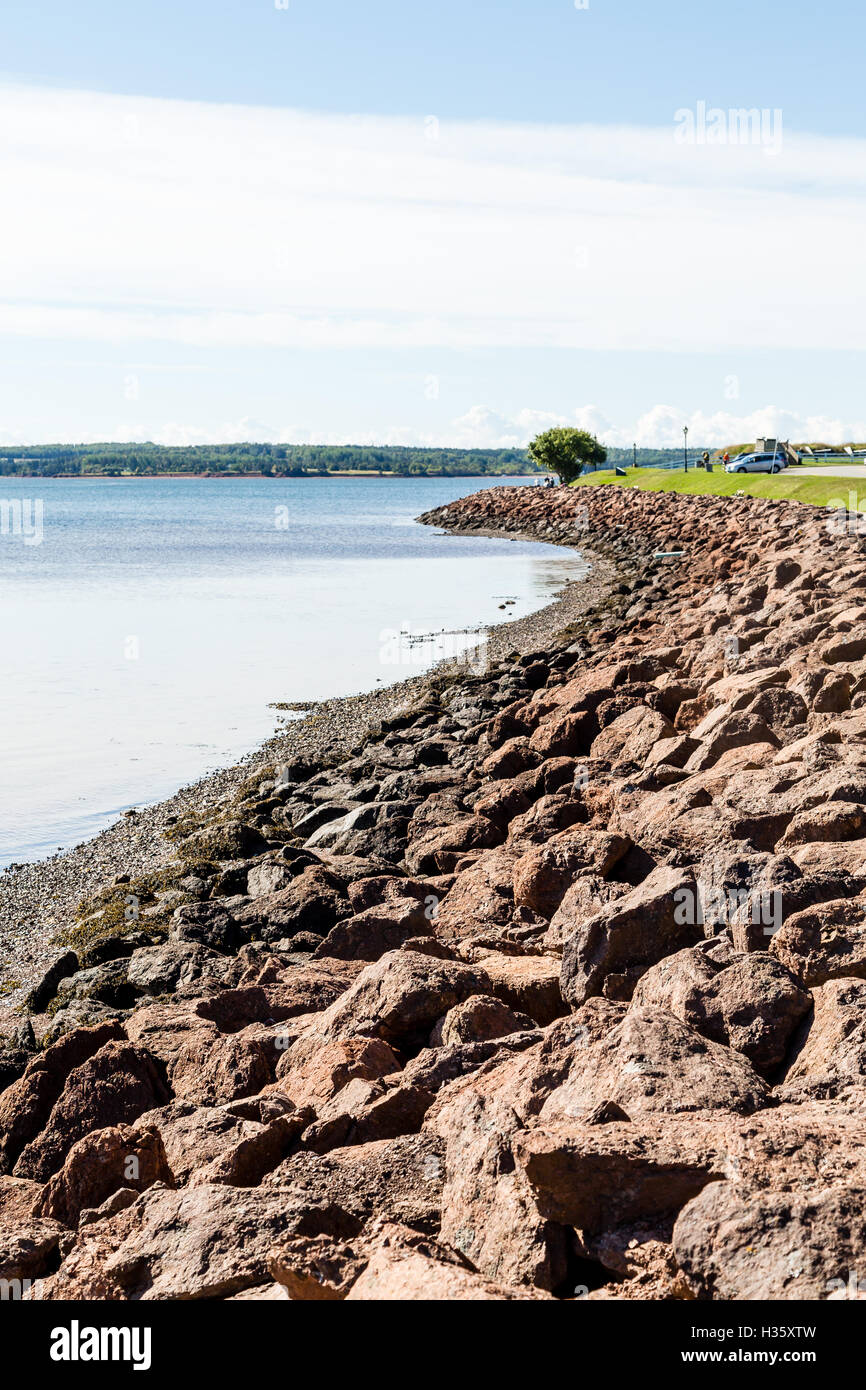 Rock Seawall on Canadian Coast under nice sky Stock Photo - Alamy