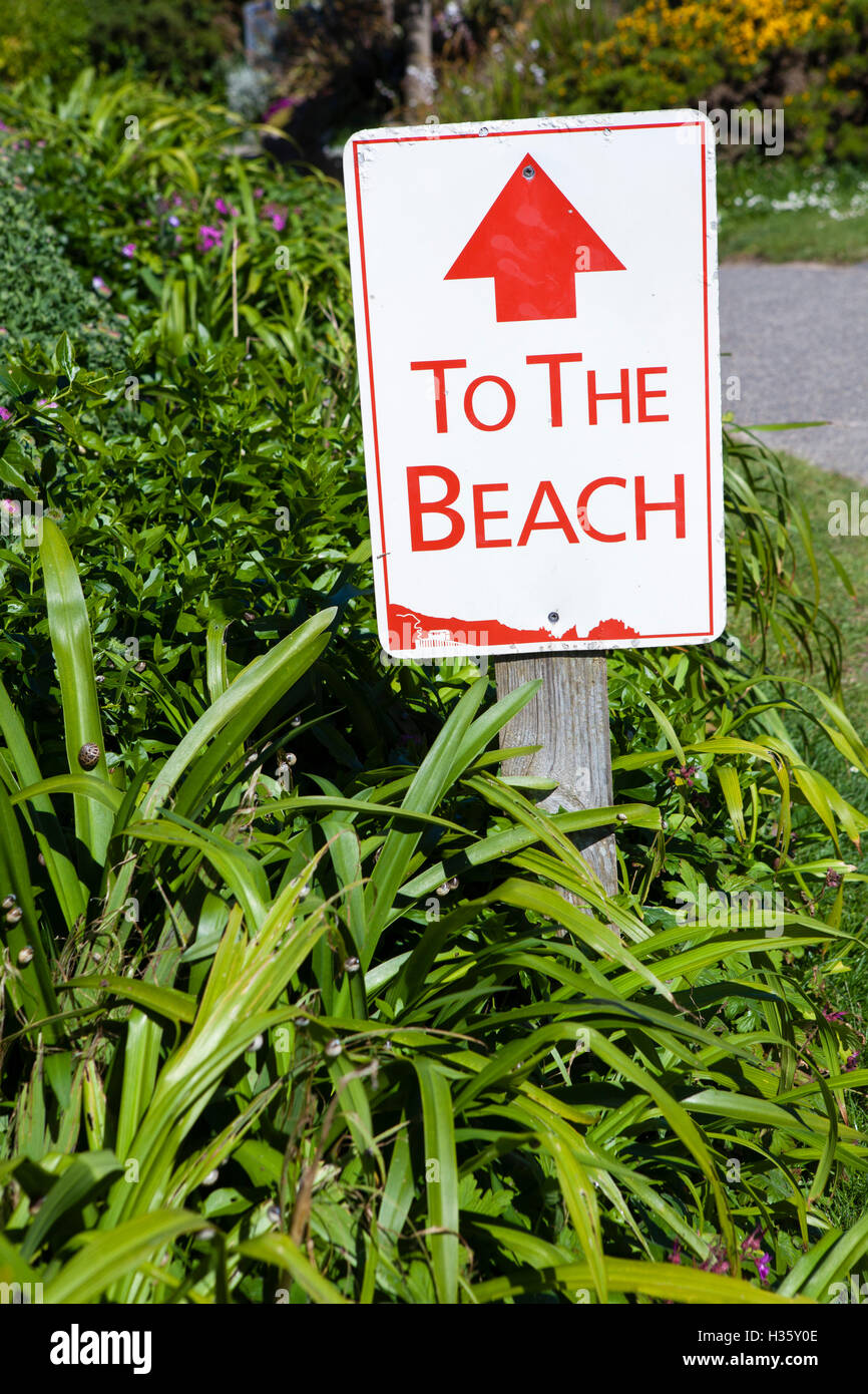 A roadside sign pointing the way to a local beach Stock Photo - Alamy