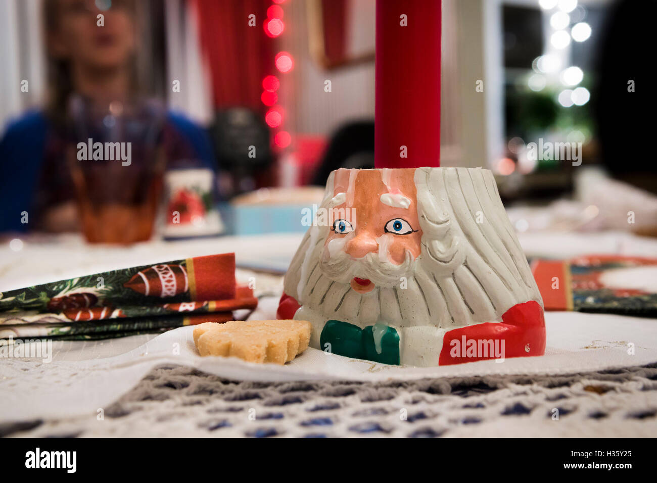 A table decoration, a candle holder in the shape of father christmas ...