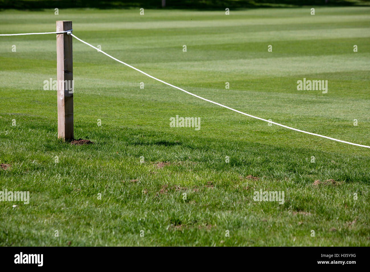 White rope fence on the edge of a cricket pitch Stock Photo - Alamy