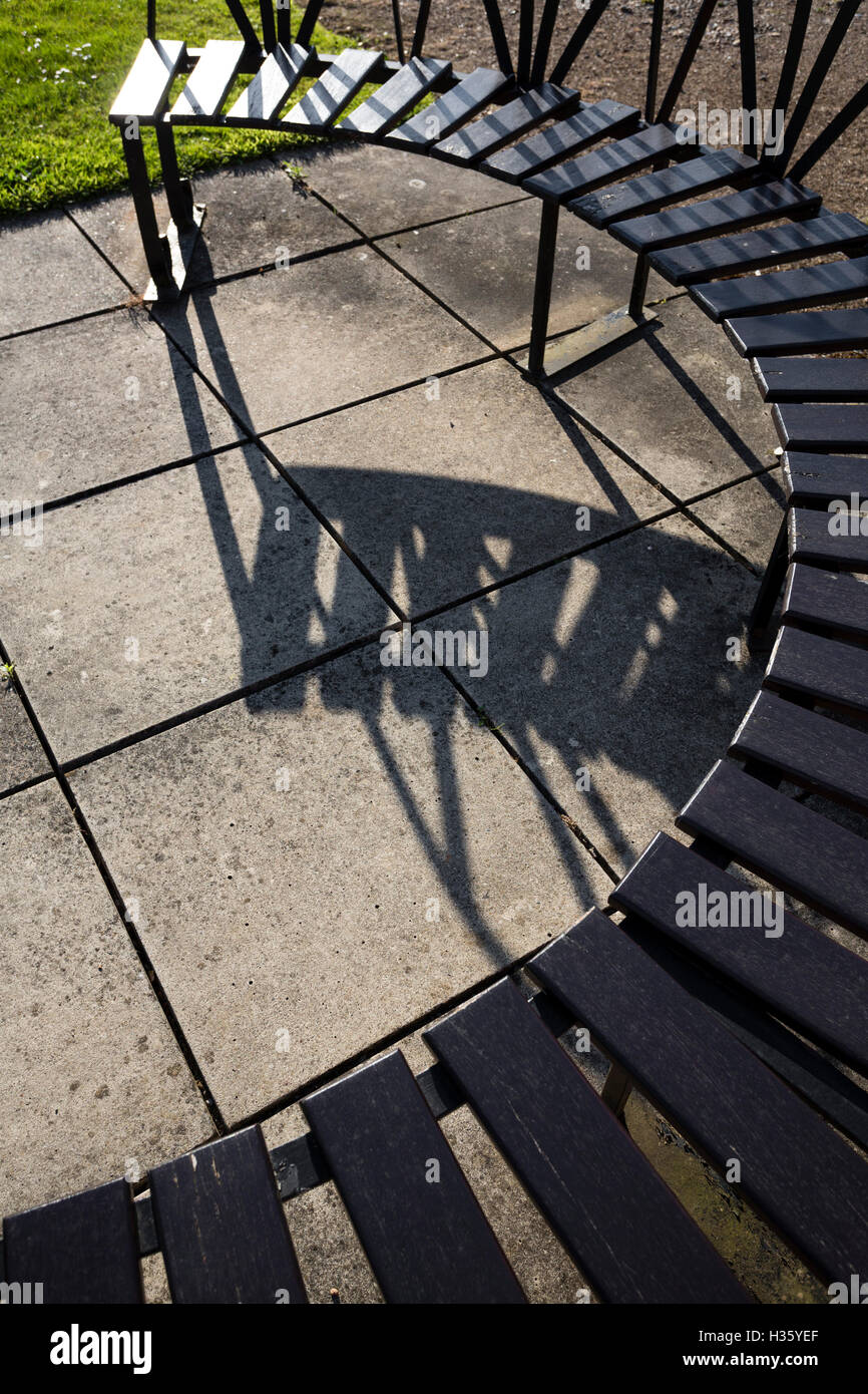Garden chairs in the sunshine with shadows Stock Photo - Alamy