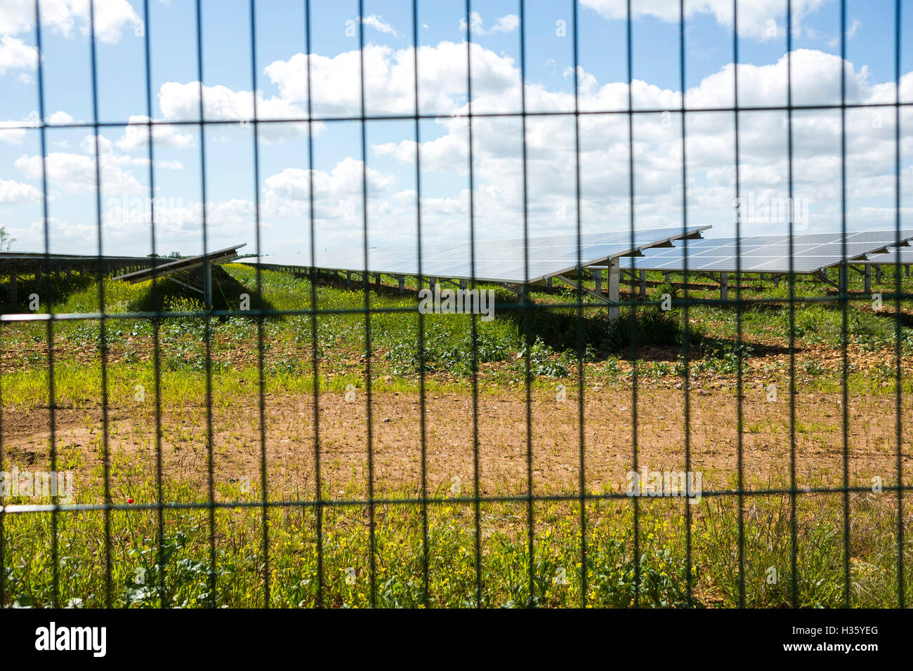 Large solar farm behind a wire fence Stock Photo - Alamy
