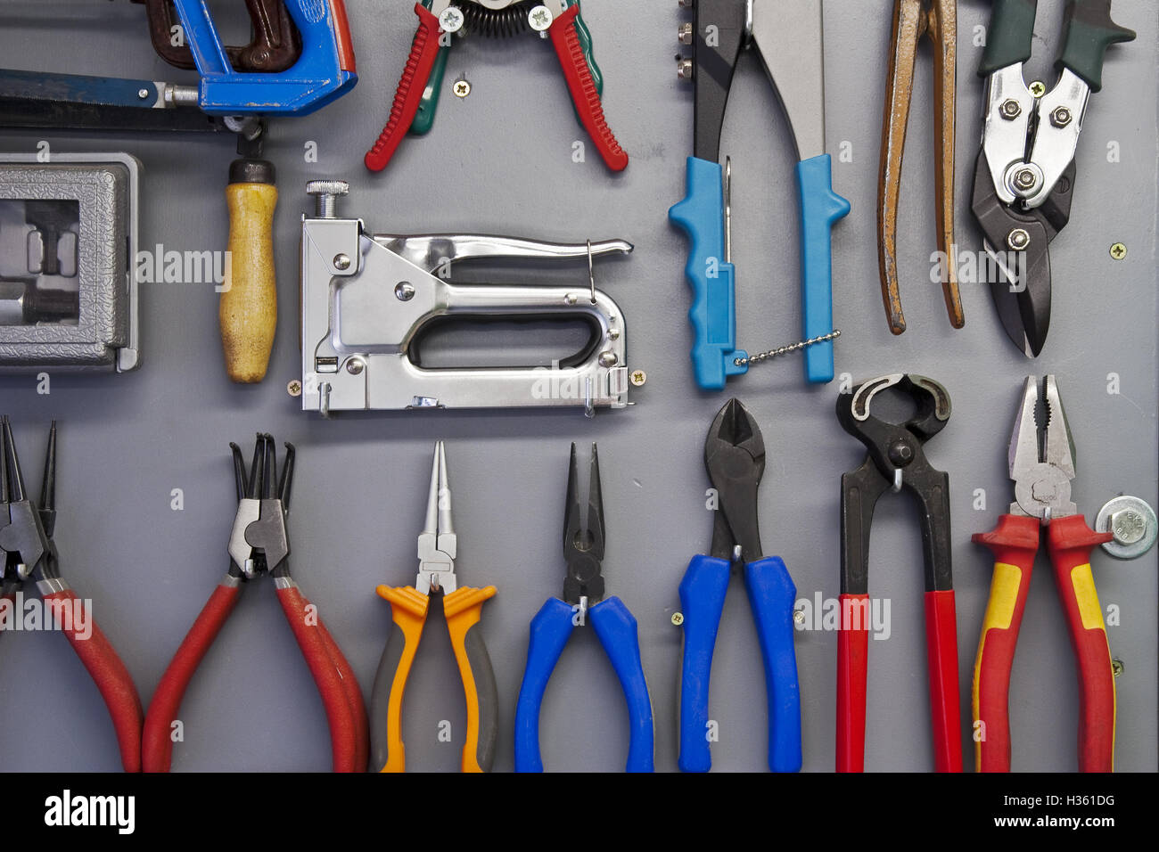 Working tools are accurately located on a workshop wall Stock Photo - Alamy