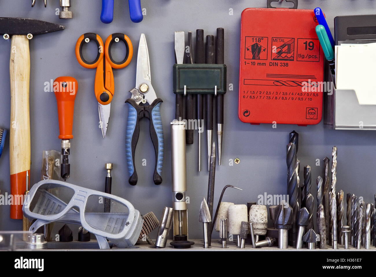 Working tools are accurately located on a workshop wall Stock Photo - Alamy