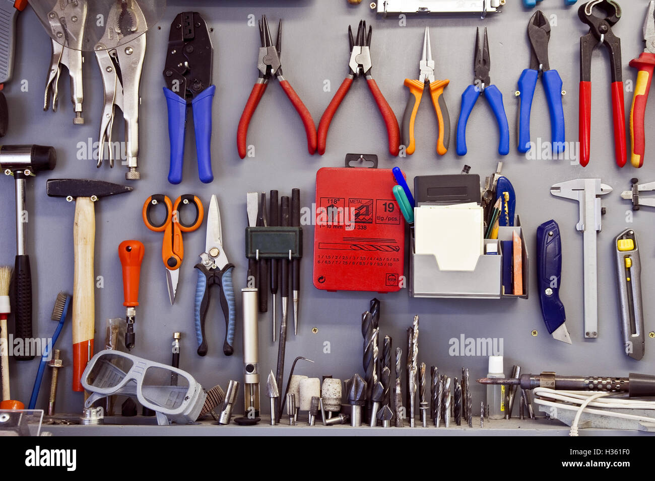 Working tools are accurately located on a workshop wall Stock Photo - Alamy