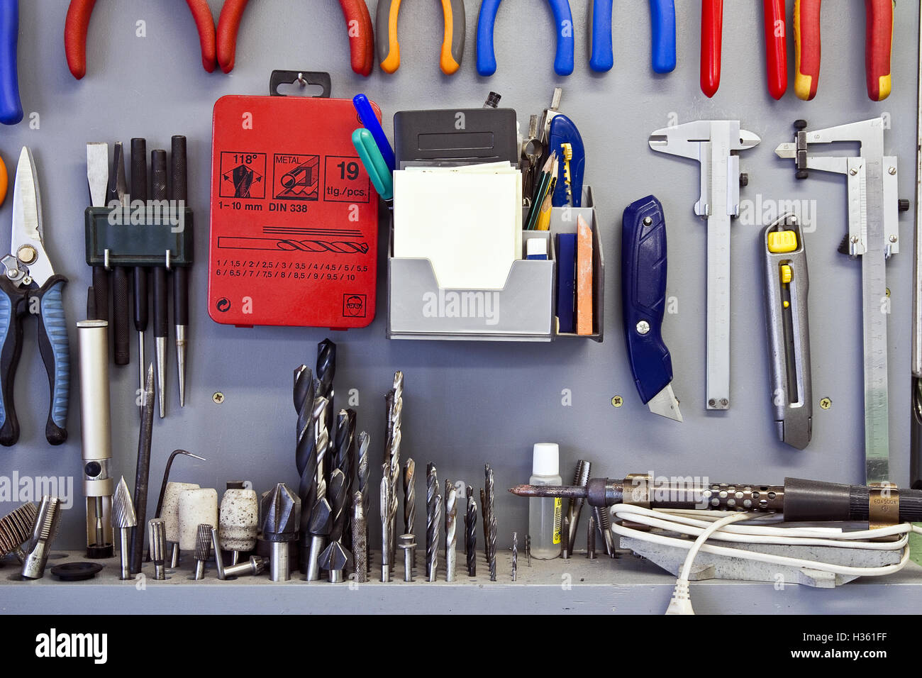 Working tools are accurately located on a workshop wall Stock Photo - Alamy