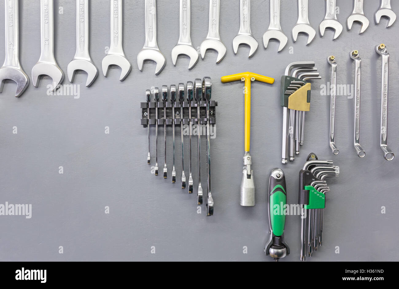 Set of hand tools on grey wooden background Stock Photo - Alamy