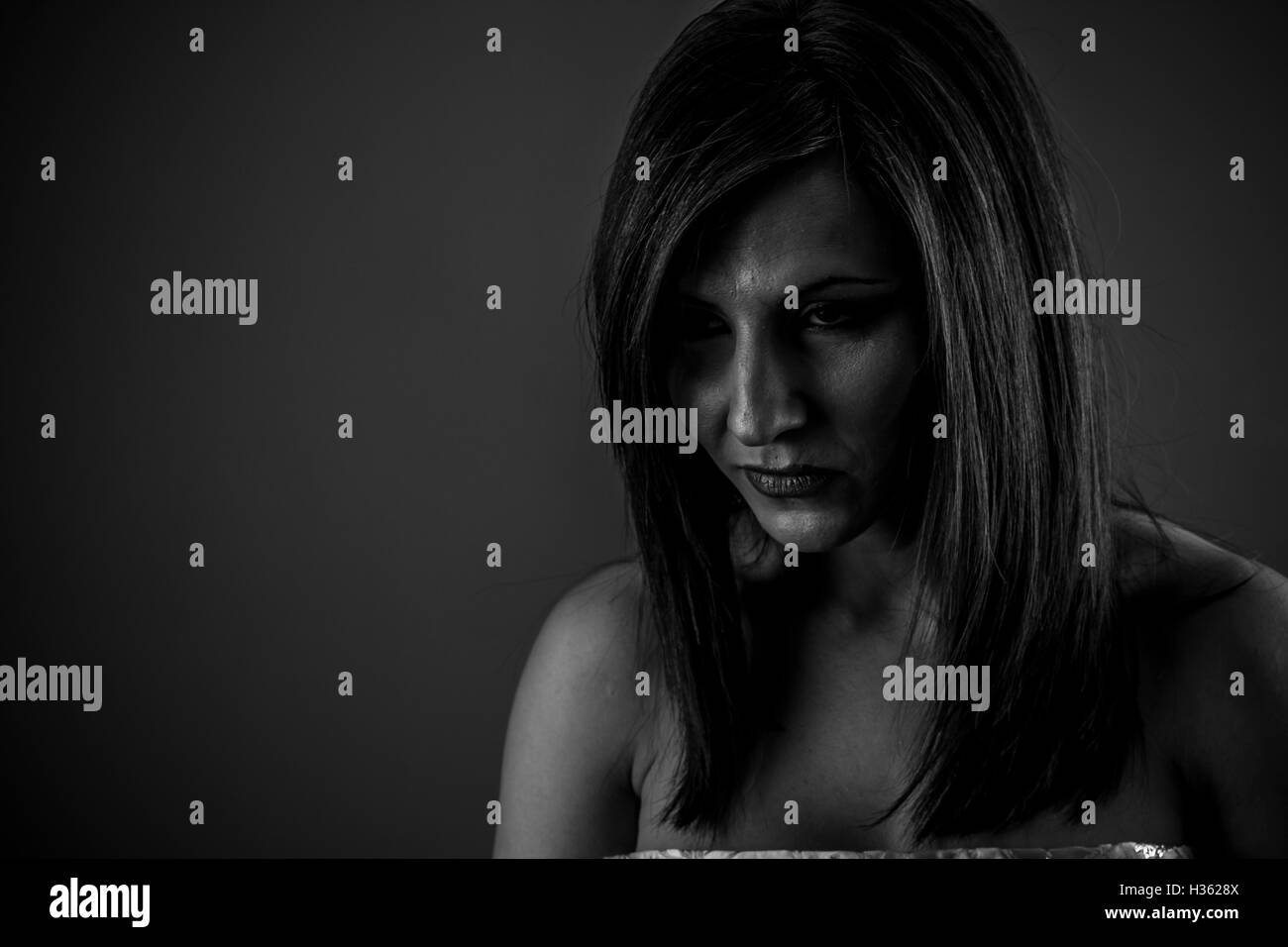 depressed, brunette woman with sad and sorry face, concept of sadness ...