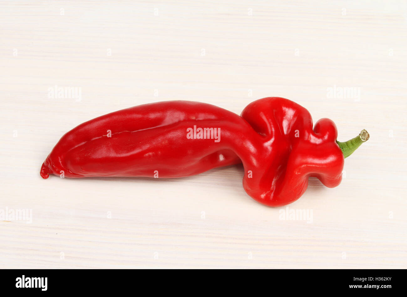 Sweet red pointed pepper on white painted wood Stock Photo - Alamy