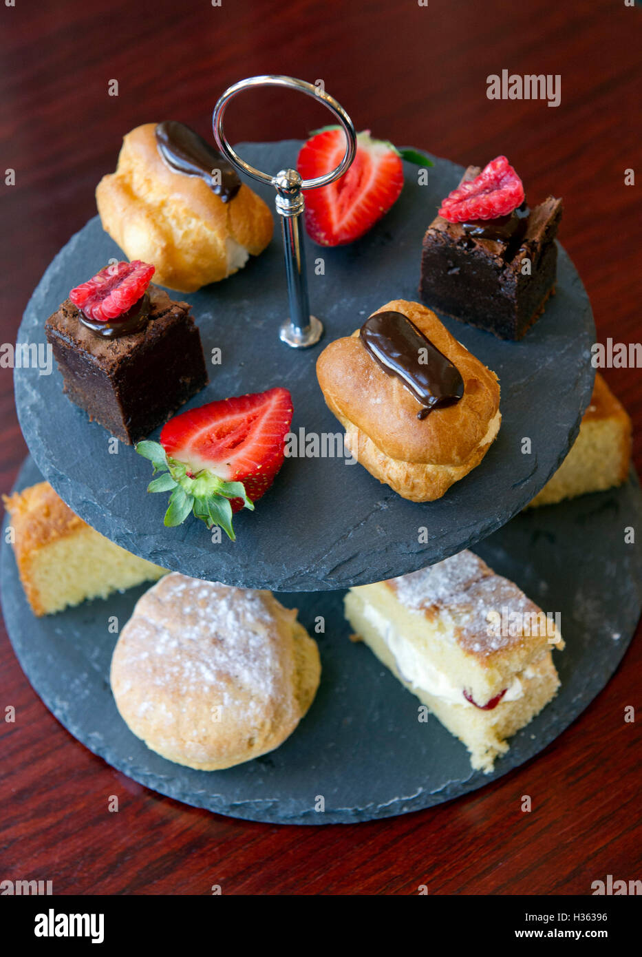 Afternoon tea with a selection of cakes Stock Photo - Alamy