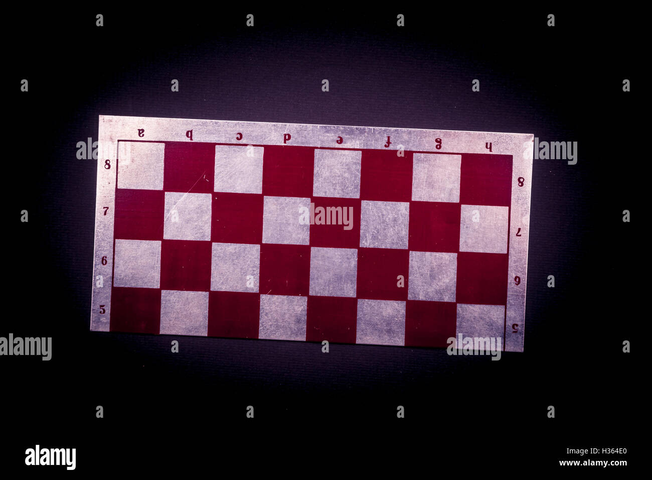Chess board on dark background Stock Photo - Alamy