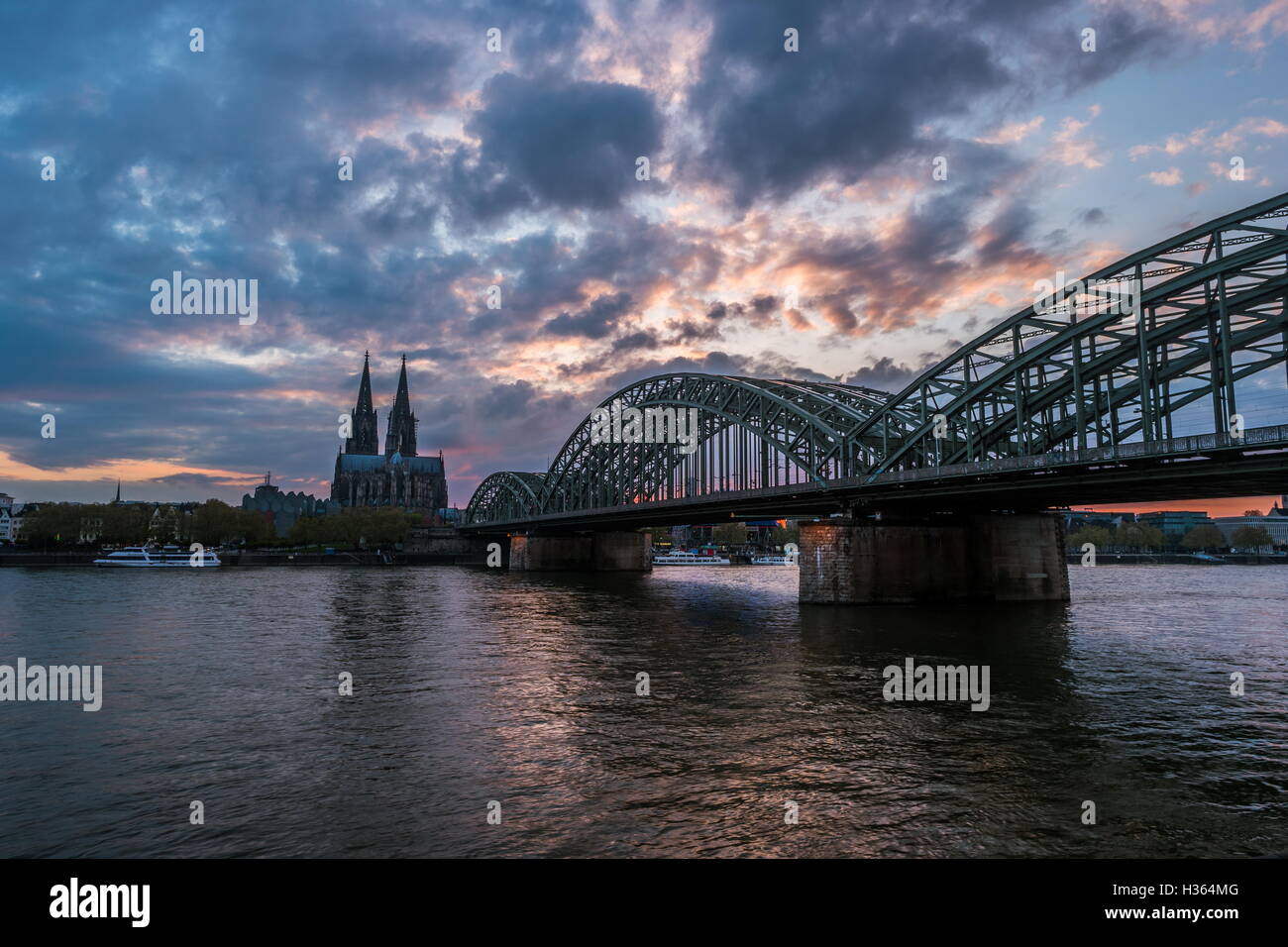 Sunset view of Cologne Cathedral and Hohenzollern Bridge Stock Photo ...