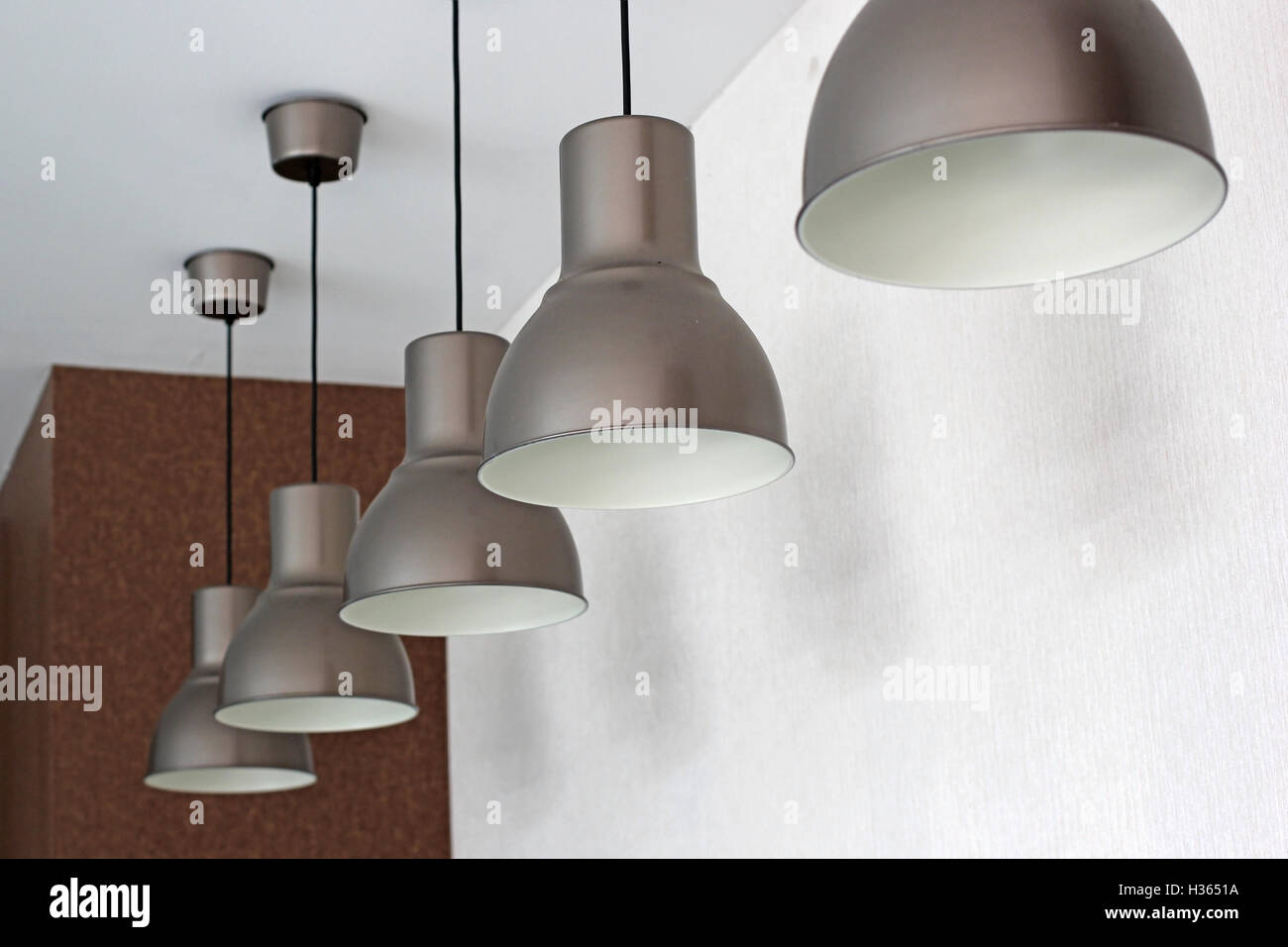 modern hanging lamp with light on ceiling Stock Photo - Alamy