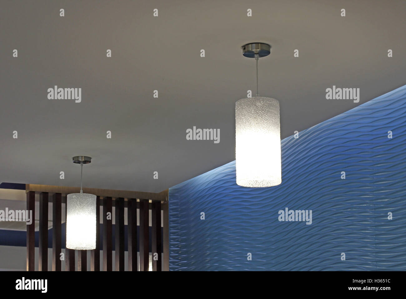 modern hanging lamp with light on ceiling Stock Photo - Alamy