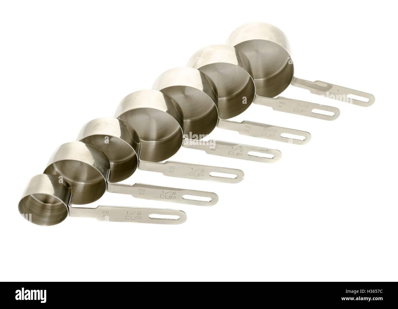 Stainless steel measuring cups on an isolated background Stock Photo ...