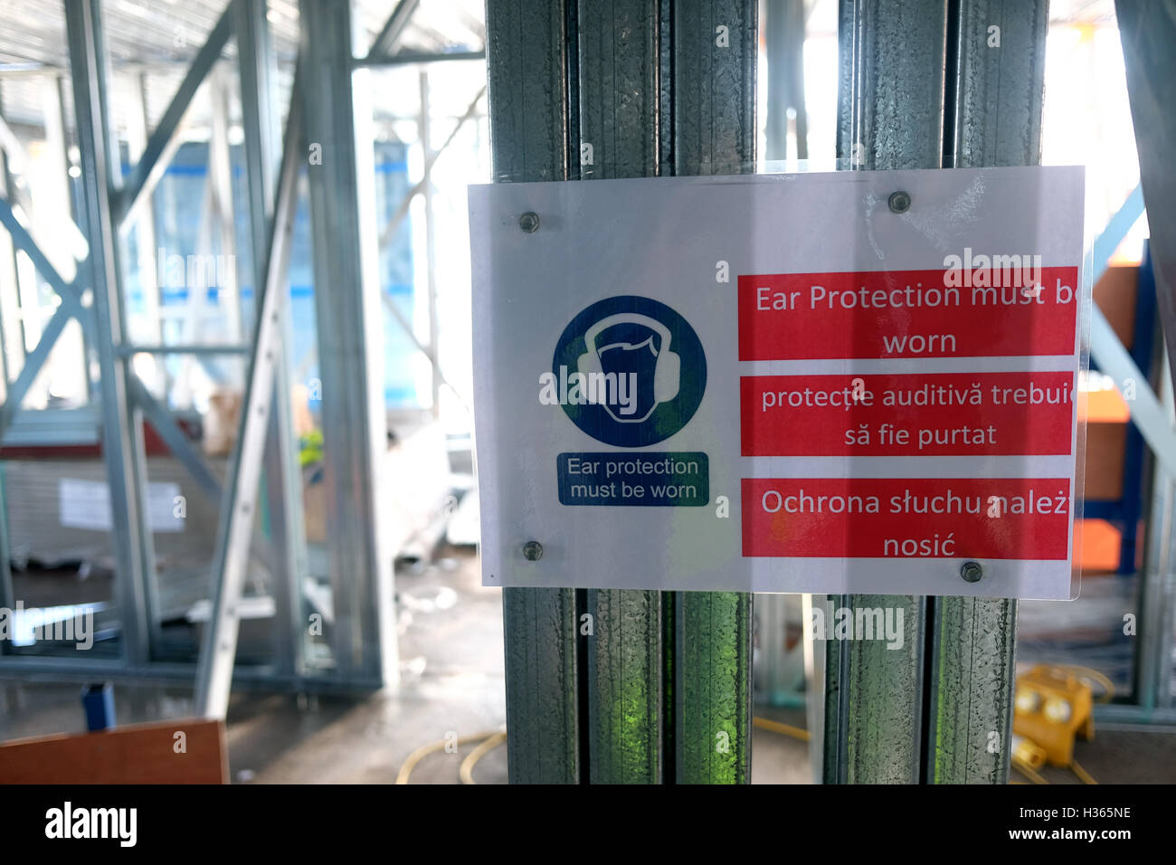 3rd October 2016, multi lingual warning sign on a construction site in ...