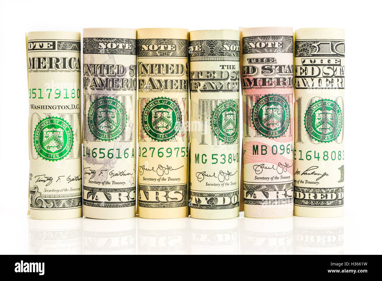 american dollar banknote rolls in all denominations in one row on white ...