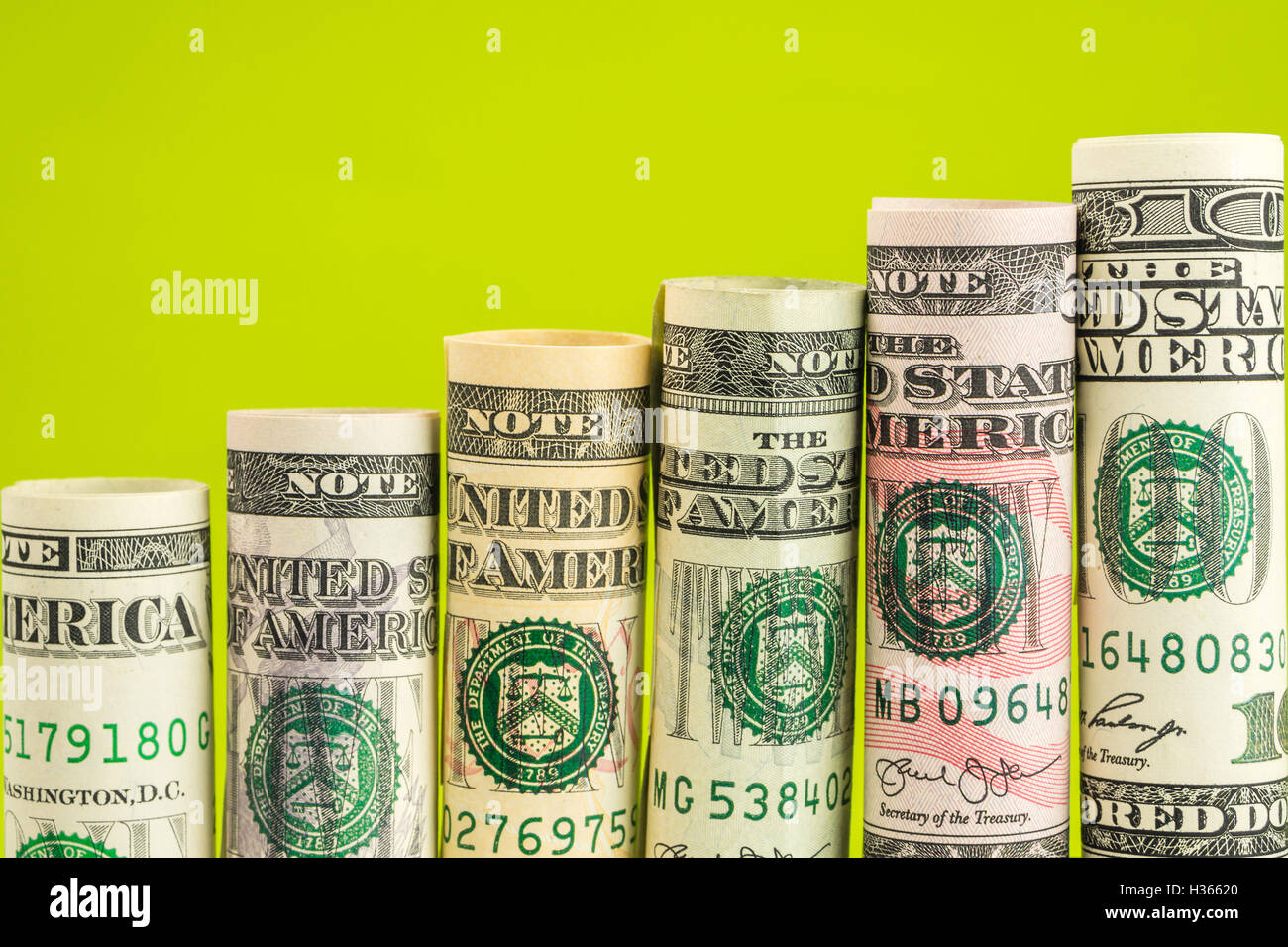 rising steps made of rolls of all american dollar banknotes in one row ...
