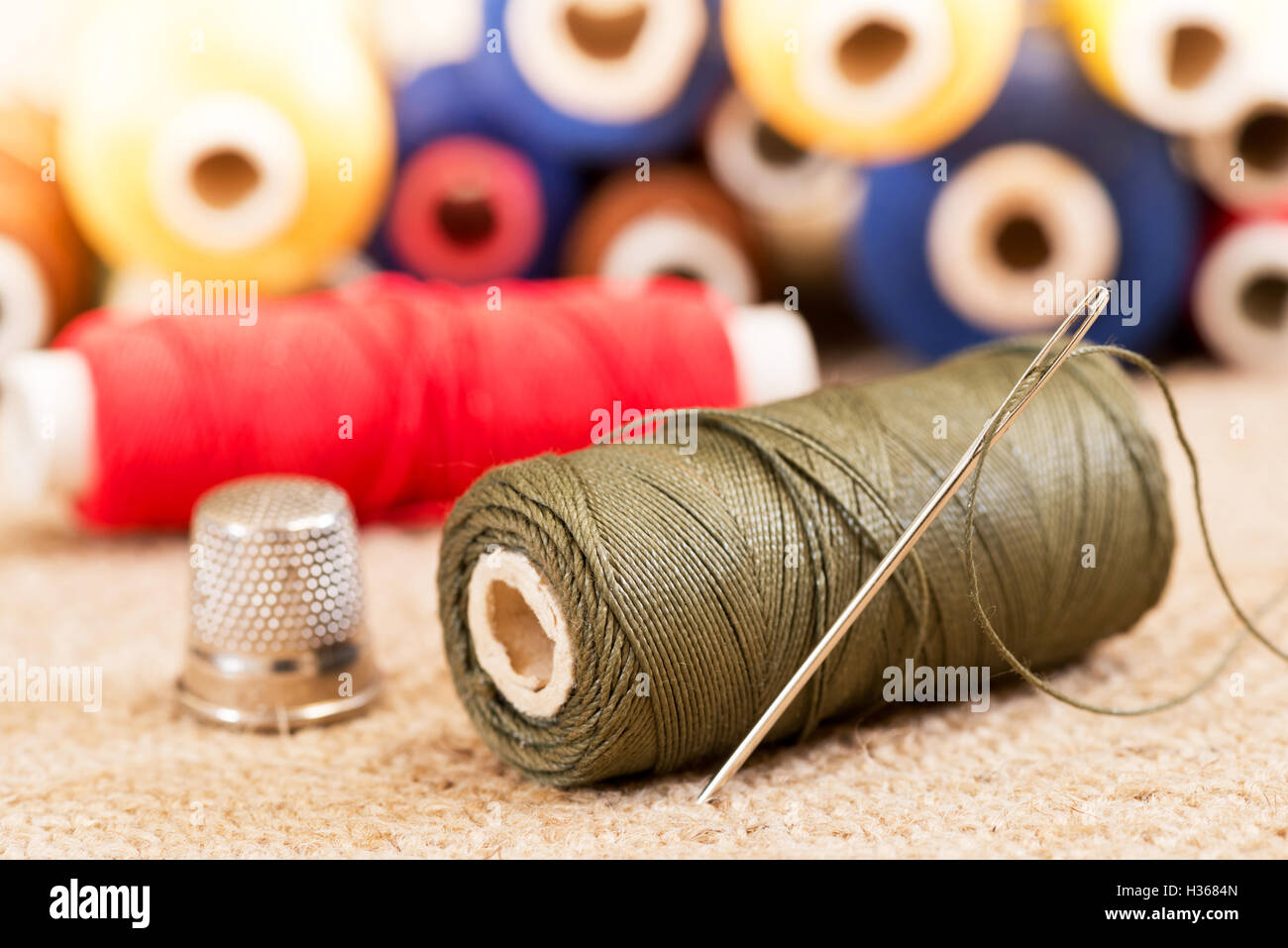detail of sewing kit in the workroom Stock Photo - Alamy