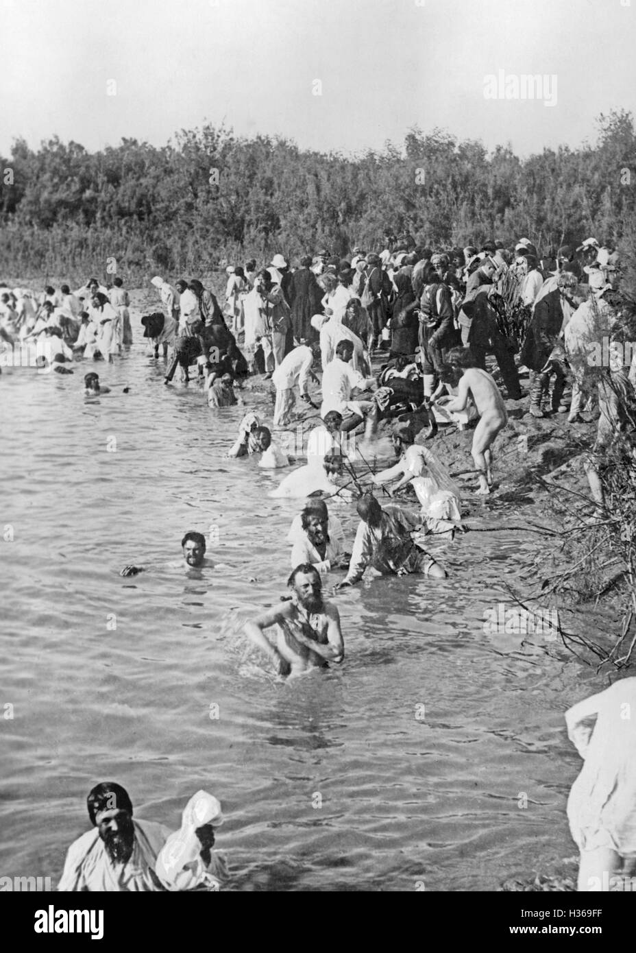Russian pilgrims bathing in the Jordan, 1908 Stock Photo - Alamy