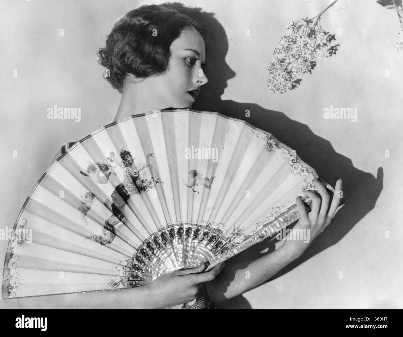 Lady with a fan, 1926 Stock Photo - Alamy