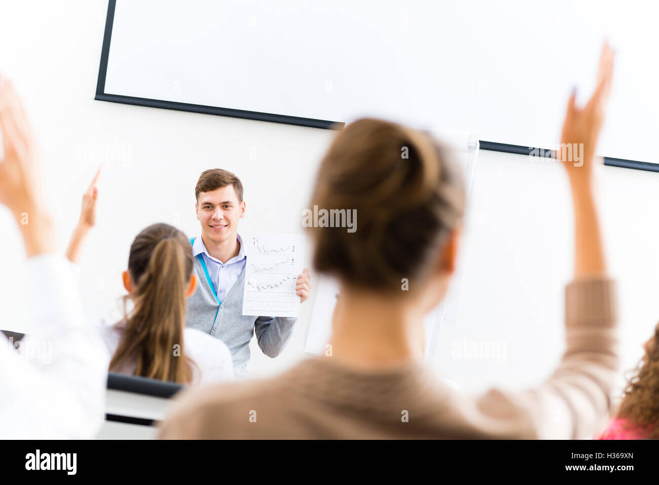 teacher talking with students Stock Photo - Alamy